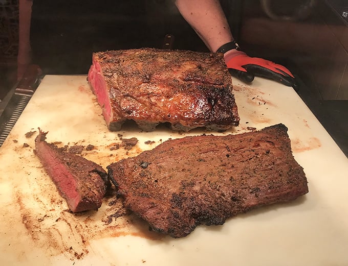 When meat meets heat and time with respect, you get this—a brisket cut that reveals that perfect pink smoke ring, the barbecue equivalent of finding buried treasure.