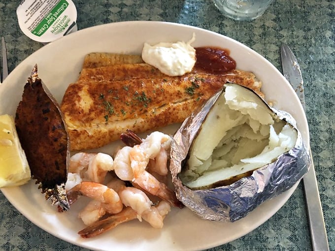 When broiled seafood meets baked potato, it's not just dinner – it's a relationship worth celebrating. That butter sauce deserves its own fan club.