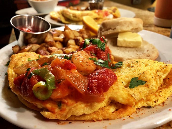 An omelet that's dressed for Mardi Gras with all those colorful vegetables. This isn't your sad diner breakfast—it's morning cuisine with ambition.