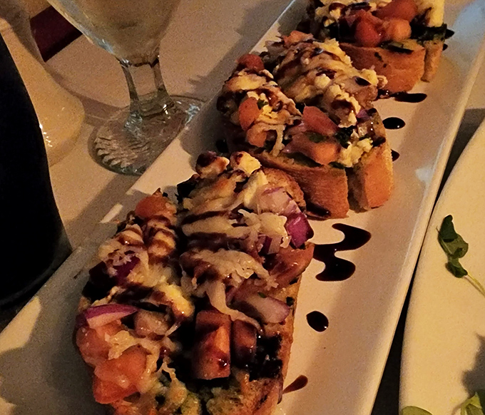 Bruschetta that makes you question why you ever settled for lesser versions. Each bite delivers a perfect harmony of tomato, cheese, and balsamic that would make an Italian grandmother nod approvingly.