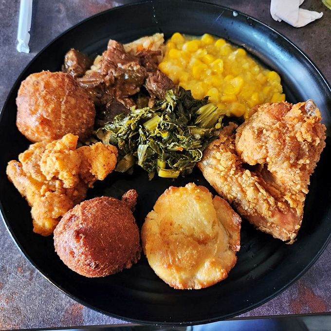 Southern comfort on a plate. Those collard greens and fried chicken have been perfecting their relationship for generations.