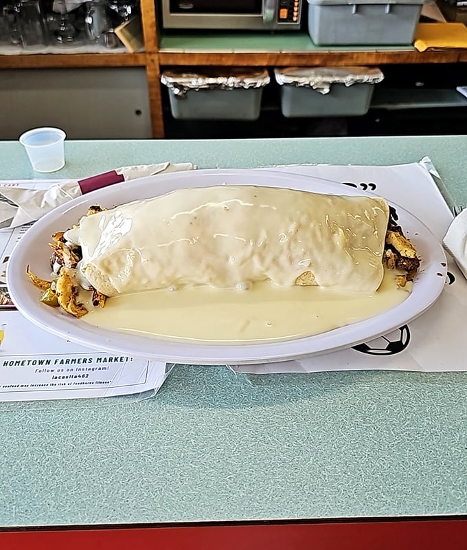 Behold the California Burrito in all its cheese-smothered glory. This isn't a meal—it's a commitment, and one worth making.