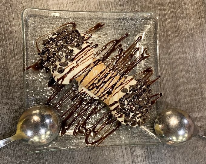 This dessert doesn't just end a meal—it provides closure. Chocolate drizzle creating Jackson Pollock art that tastes even better than it looks.