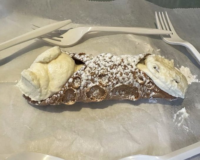 Sweet endings come in flaky packages. This cannoli is the dessert equivalent of a standing ovation – crisp shell, creamy filling, powdered perfection.
