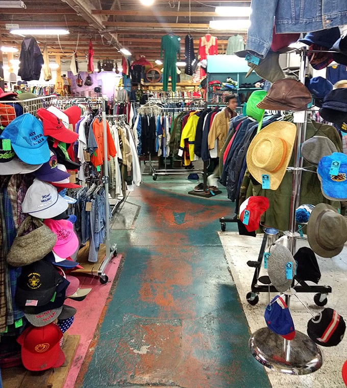 A hat collector's paradise where baseball caps from forgotten tournaments mingle with sun hats that have stories to tell.