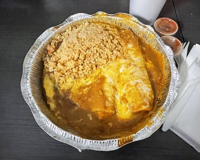 Cheese enchiladas swimming in rich sauce, proving comfort food transcends all cultural boundaries perfectly
