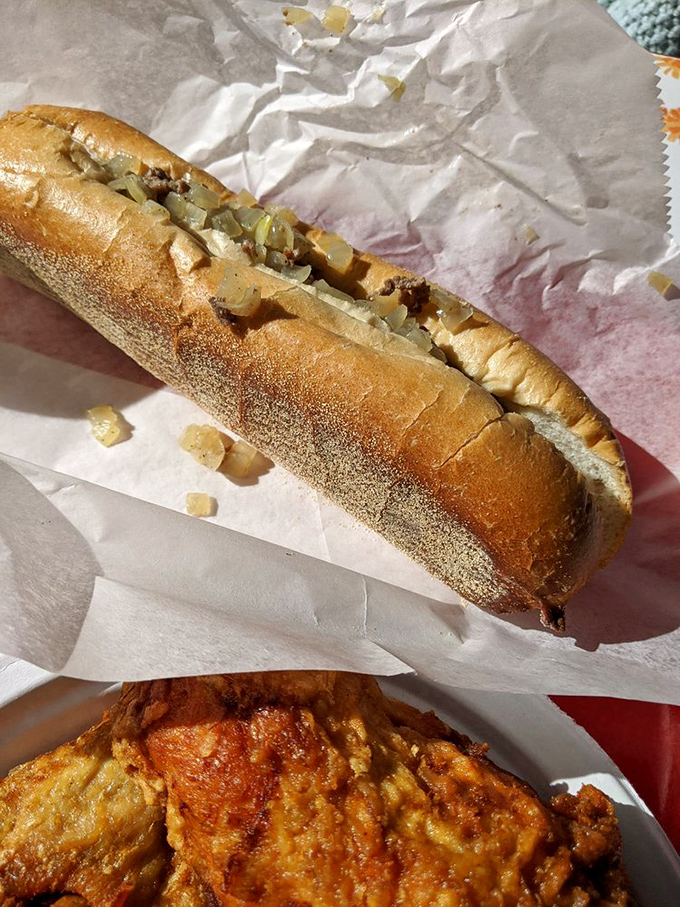 The cheesesteak and chicken combo—Pennsylvania's dynamic duo. This isn't just a sandwich; it's edible state pride wrapped in wax paper.