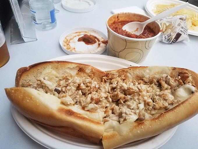 Behold the cheesesteak that dreams are made of – perfectly melted cheese cascading over tender beef in crusty perfection.
