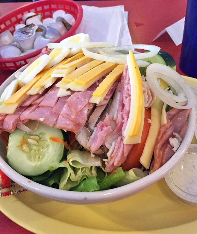 A chef's salad that doesn't apologize for its abundance—layers of ham, cheese, and fresh vegetables that make "eating healthy" actually enjoyable.