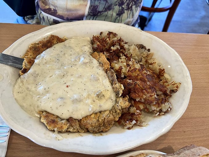 Country-fried steak smothered in gravy with those famous hashbrowns. A plate that says, "Take the afternoon off, you'll need a nap."