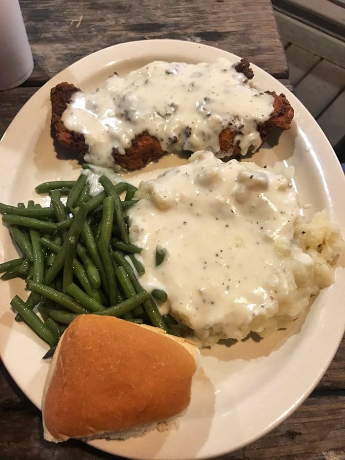 Chicken fried steak smothered in pepper gravy—the dish that's comforted Texans since cattle first roamed the plains. Pure comfort on a plate.