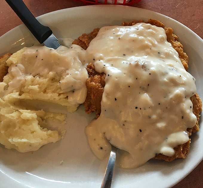 Chicken fried steak with mashed potatoes—the comfort food equivalent of a warm blanket on a cold Missouri evening. Gravy perfection.