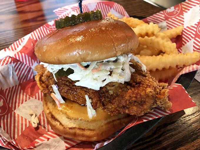 The sandwich that launched a thousand napkins. Crispy chicken, cooling slaw, and those essential pickles, all nestled in a pillowy bun.