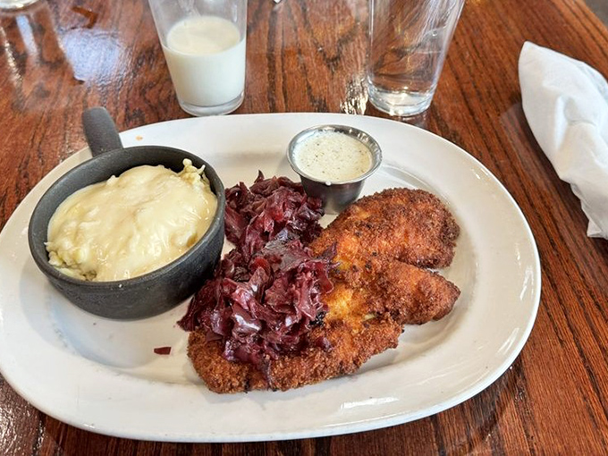 Chicken schnitzel that's traveled from Vienna to Pennsylvania without losing its dignity—golden, crispy, and ready for its close-up.