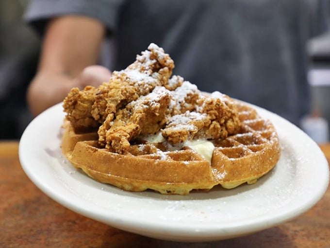 Chicken and waffles—the breakfast-meets-lunch romance that proves opposites really do attract. That powdered sugar dusting? Just showing off at this point.