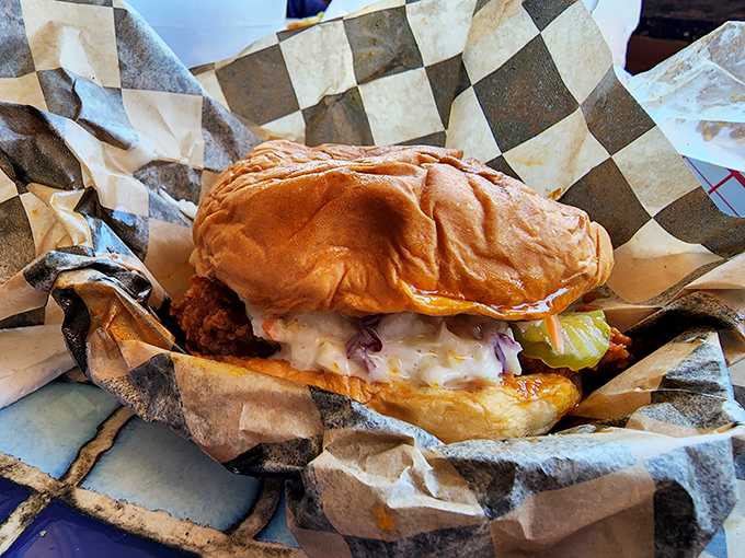 This chicken sandwich isn't just lunch—it's architecture, with layers of crunch, cool slaw, and creamy sauce creating the Taj Mahal of handheld meals.