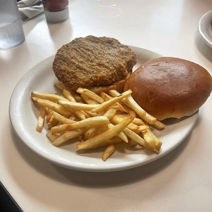 A sandwich that doesn't need a fancy name or artisanal bread—just honest ingredients stacked between bread with fries that never went to finishing school.