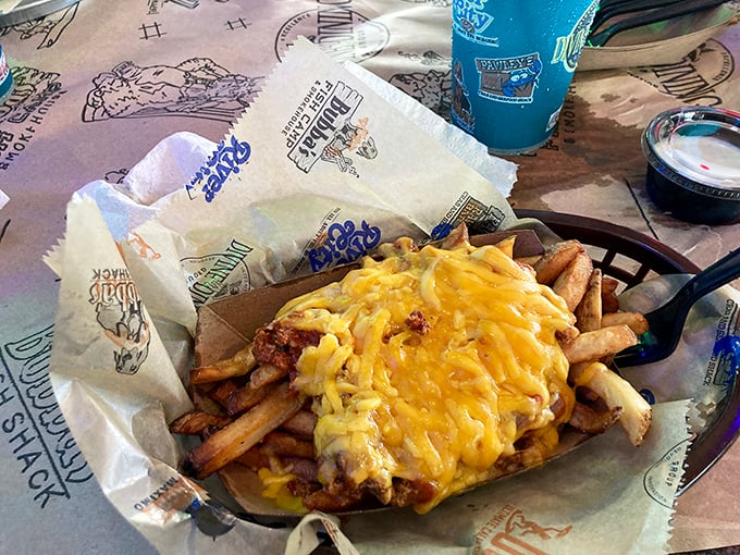Loaded fries that laugh in the face of diet plans. That molten cheese blanket covering every inch is what comfort food dreams are made of.