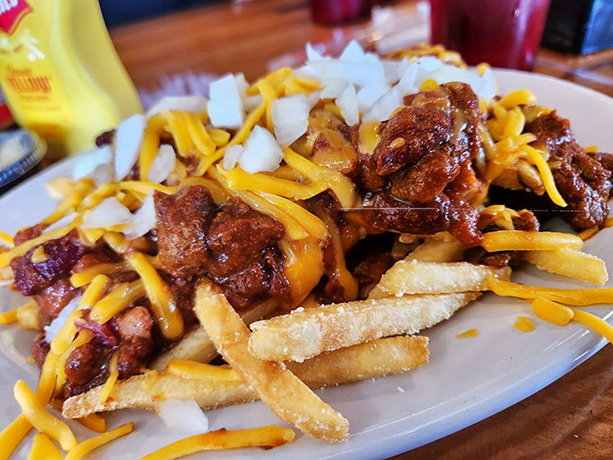 Chili cheese fries that don't apologize for being exactly what they are: a glorious mess of comfort that demands both napkins and your full attention.