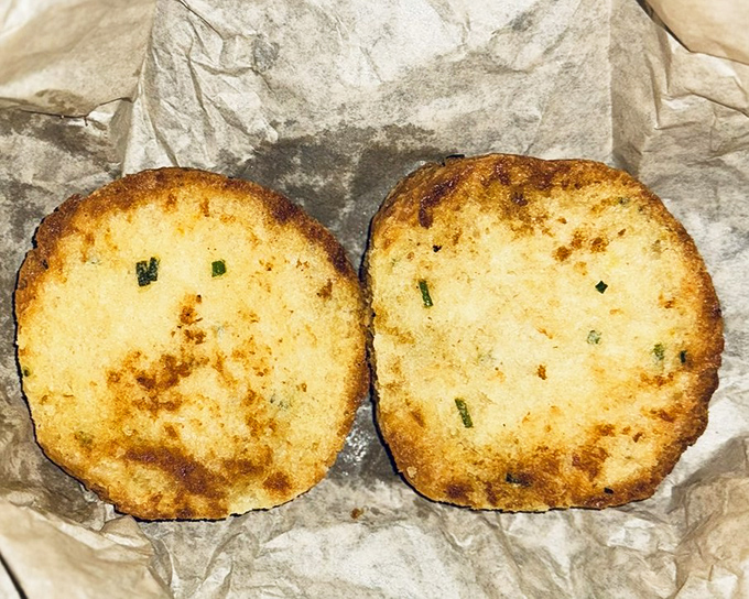 These chive biscuits aren't just baked, they're crafted—golden discs of comfort food that grandmothers everywhere would proudly claim as their own.