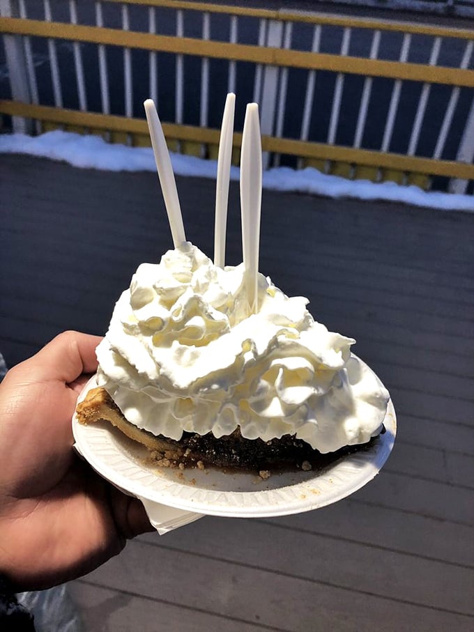 A slice of chocolate shoo-fly pie topped with a mountain of whipped cream—because sometimes more is exactly the right amount.