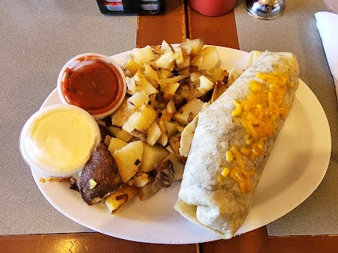 This burrito doesn't just satisfy hunger—it conquers it! Stuffed with goodness and flanked by home fries, it's a southwestern morning masterpiece.