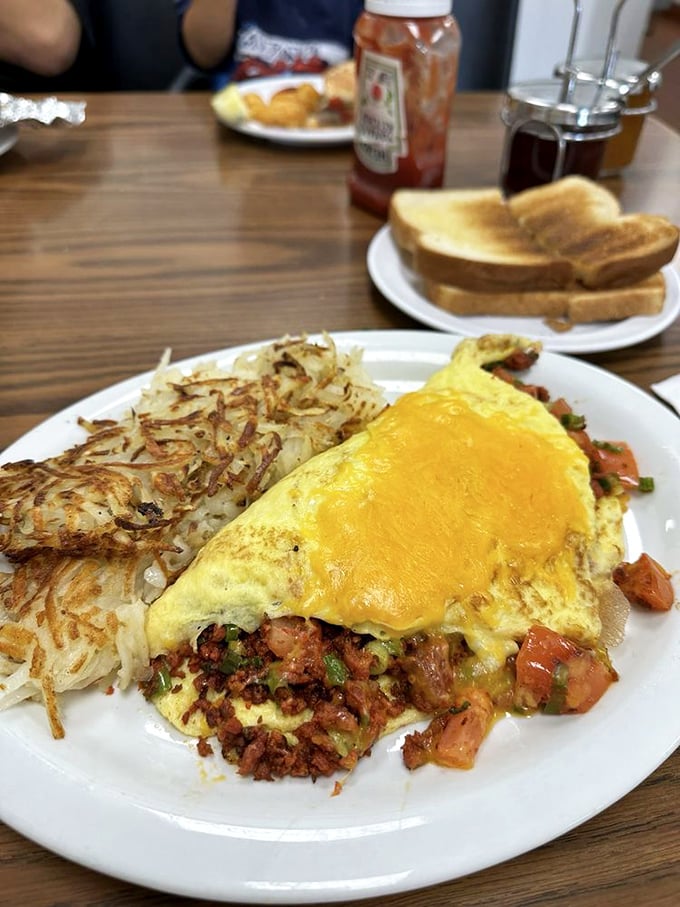 An omelet with ambition. Those hash browns achieved the crispiness level that world peace negotiations should aspire to—perfect harmony of textures.