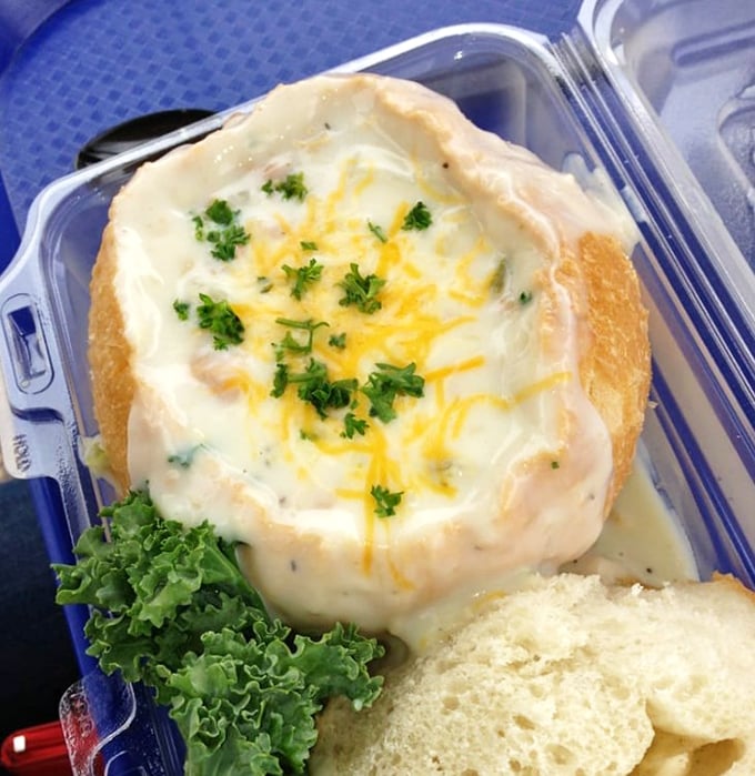 Bread bowls: where soup meets architectural achievement. This clam chowder isn't just eaten—it's experienced, one creamy, cheese-topped spoonful at a time.