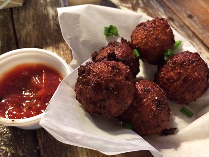 These conch fritters aren't just appetizers – they're little spheres of happiness. Crispy outside, tender inside, and that dipping sauce? Pure magic.
