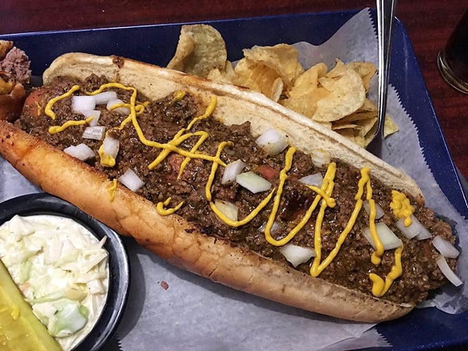 This isn't just a hot dog; it's a Coney masterpiece with a blanket of seasoned meat and a yellow mustard racing stripe. Pure Americana on a bun.