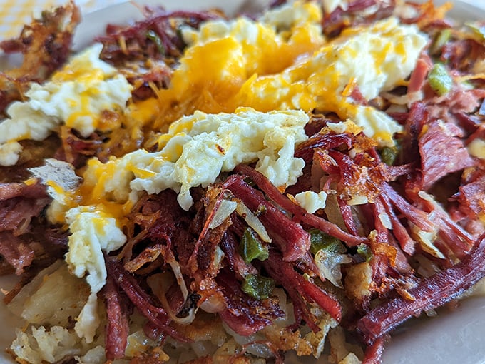 This isn't your sad canned hash—it's a beautiful relationship between house-corned beef, crispy potatoes, and eggs that just works.