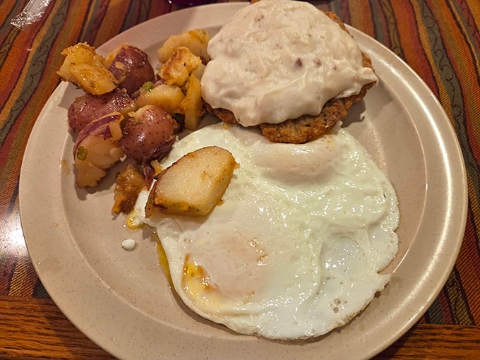 Country fried steak smothered in gravy with a side of home fries and eggs – the kind of breakfast that fueled America's greatest generation.