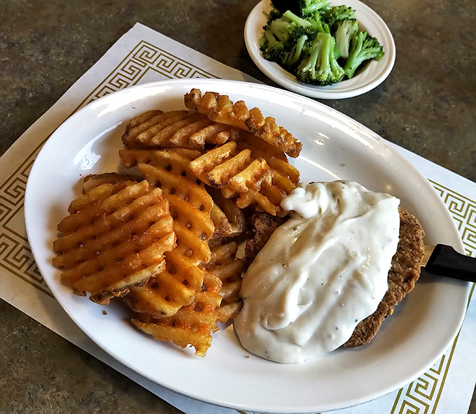 The legendary country fried steak with its golden armor of crispy coating and river of creamy gravy. This isn't just dinner—it's an Ohio institution.