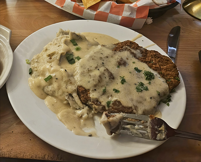 Country fried steak that renders conversation impossible. That golden crust and pepper-flecked gravy deserve your full, undivided attention and respect.