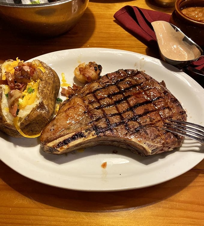 The T-bone steak and loaded potato—a pairing as classic as Sinatra and bourbon, but with better grill marks.