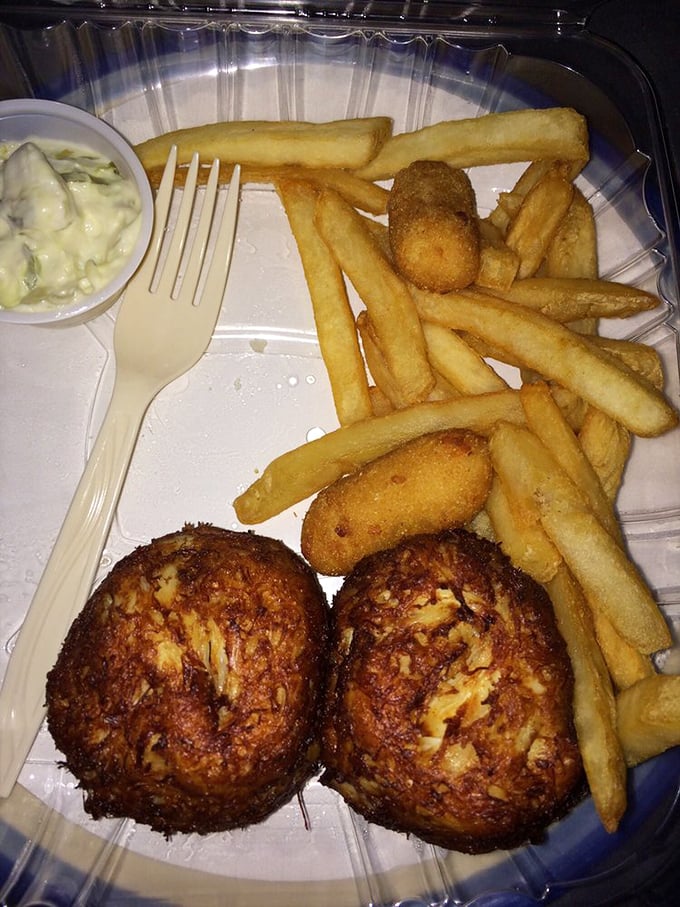 Crab cakes that are all meat, no filler—the way God intended. Served with fries and coleslaw, they're the reason people drive for hours without complaint.
