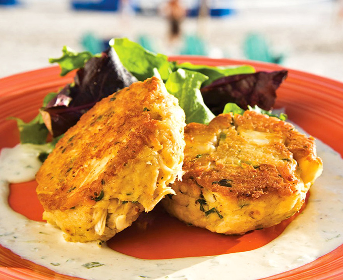 Crab cakes so golden and plump they deserve their own currency. These beauties balance delicate crab flavor with a perfect crispy exterior.