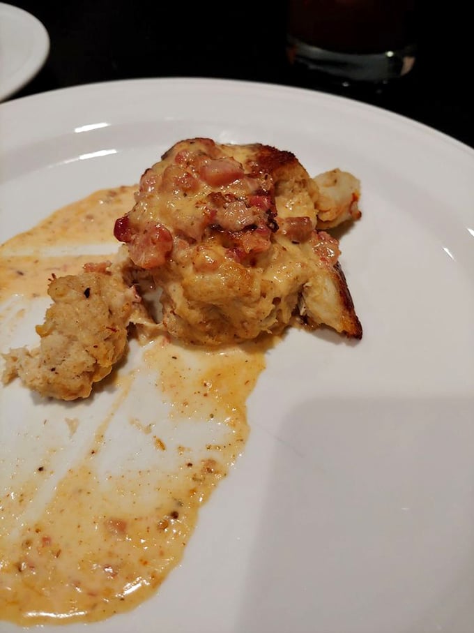 The crab cake—more crab than cake—sits in a delicate sauce that would make Maryland natives question their loyalty.