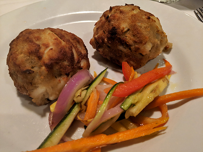 These aren't just crab cakes; they're seafood sculptures with a golden crust that crackles with promise and a tender interior that delivers.