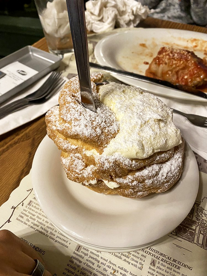 The legendary cream puff in all its powdered-sugar glory—a pastry so impressive it deserves its own Ohio state holiday.