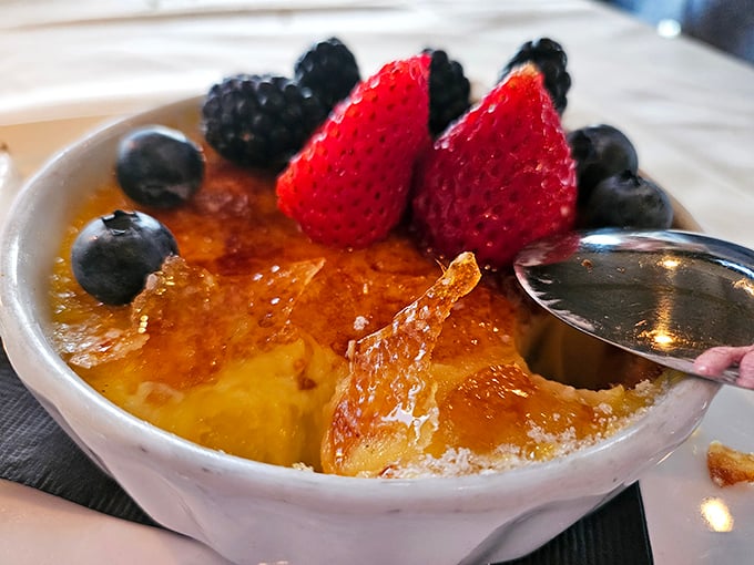 Crack through this crème brûlée's glassy caramelized top and you'll find custard so silky it could moonlight as a luxury bedsheet.