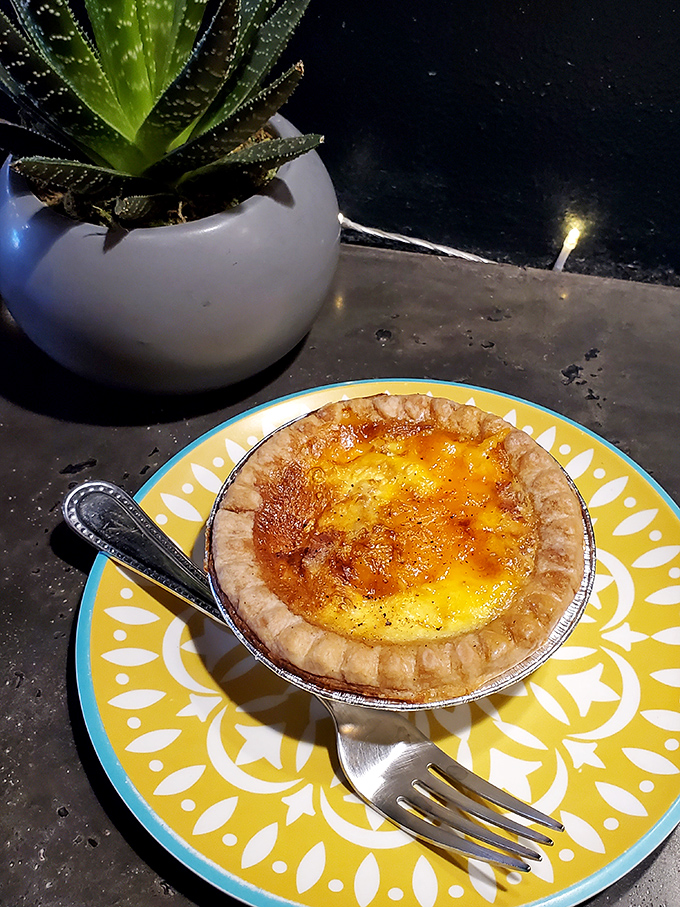 This crème brûlée pie on a sunshine-yellow plate is what happens when dessert gets dressed up for a special occasion.