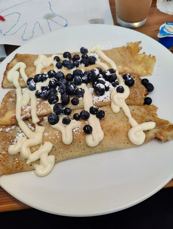 These crepes are wearing berries and cream like they're dressed for the breakfast equivalent of the Met Gala—elegant yet approachable.