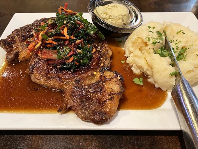This Delmonico steak isn't just dinner—it's a religious experience with a side of mashed potatoes and perfectly sautéed greens.