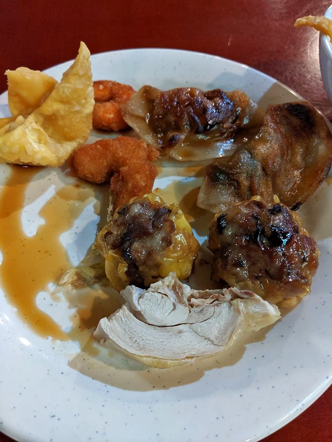 A plate of culinary greatest hits—crispy wontons, savory dumplings, and tender chicken—the buffet equivalent of a mixtape for your taste buds.