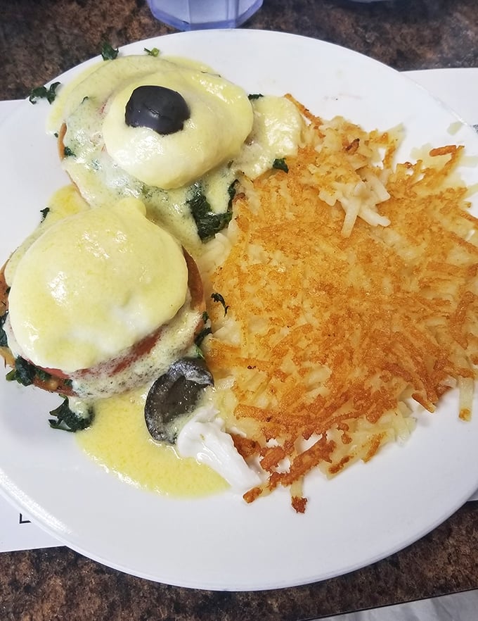 Eggs Benedict with perfectly poached eggs and crispy hash browns—the breakfast equivalent of finding front-row concert tickets in your coat pocket.