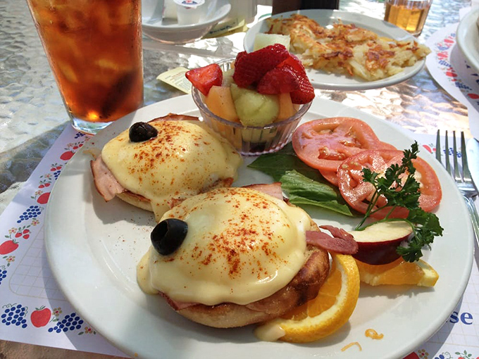 Behold the legendary Eggs Benedict—where hollandaise sauce cascades like a buttery waterfall over perfectly poached eggs. Worth every mile of the drive.