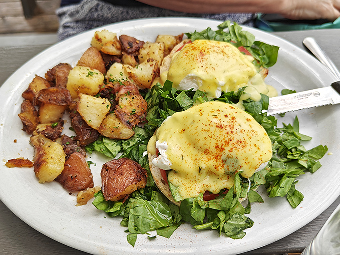Behold the holy grail of brunch—eggs Benedict with perfectly poached eggs and potatoes that deserve their own fan club.