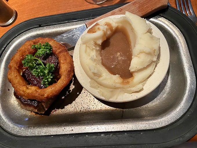 Steak and potatoes elevated to art form – this filet with its velvety center and the mashed potatoes drowning happily in gravy represents comfort food perfection.