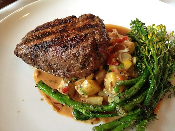 The filet mignon that launched a thousand return visits. That perfect crust gives way to buttery tenderness while the vegetables and sauce perform a perfect harmony underneath.